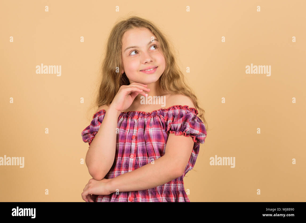 Adorable beauty model with cute smile. Small child long hair cheerful ...