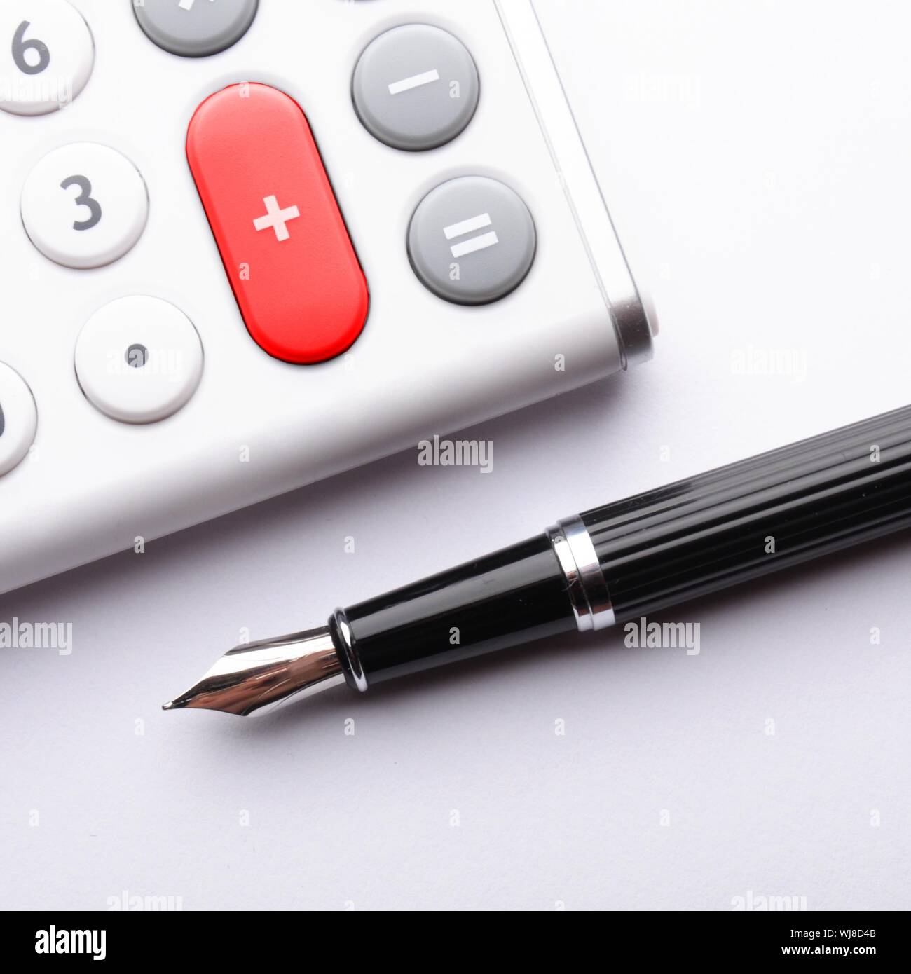 business calculation concept with modern white calculator Stock Photo ...