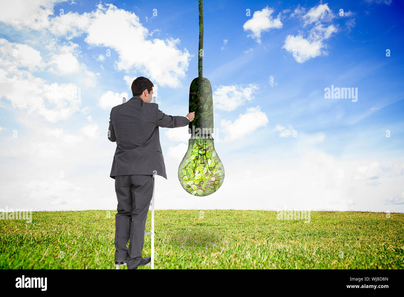 Composite image of businessman standing on ladder writing Stock Photo ...