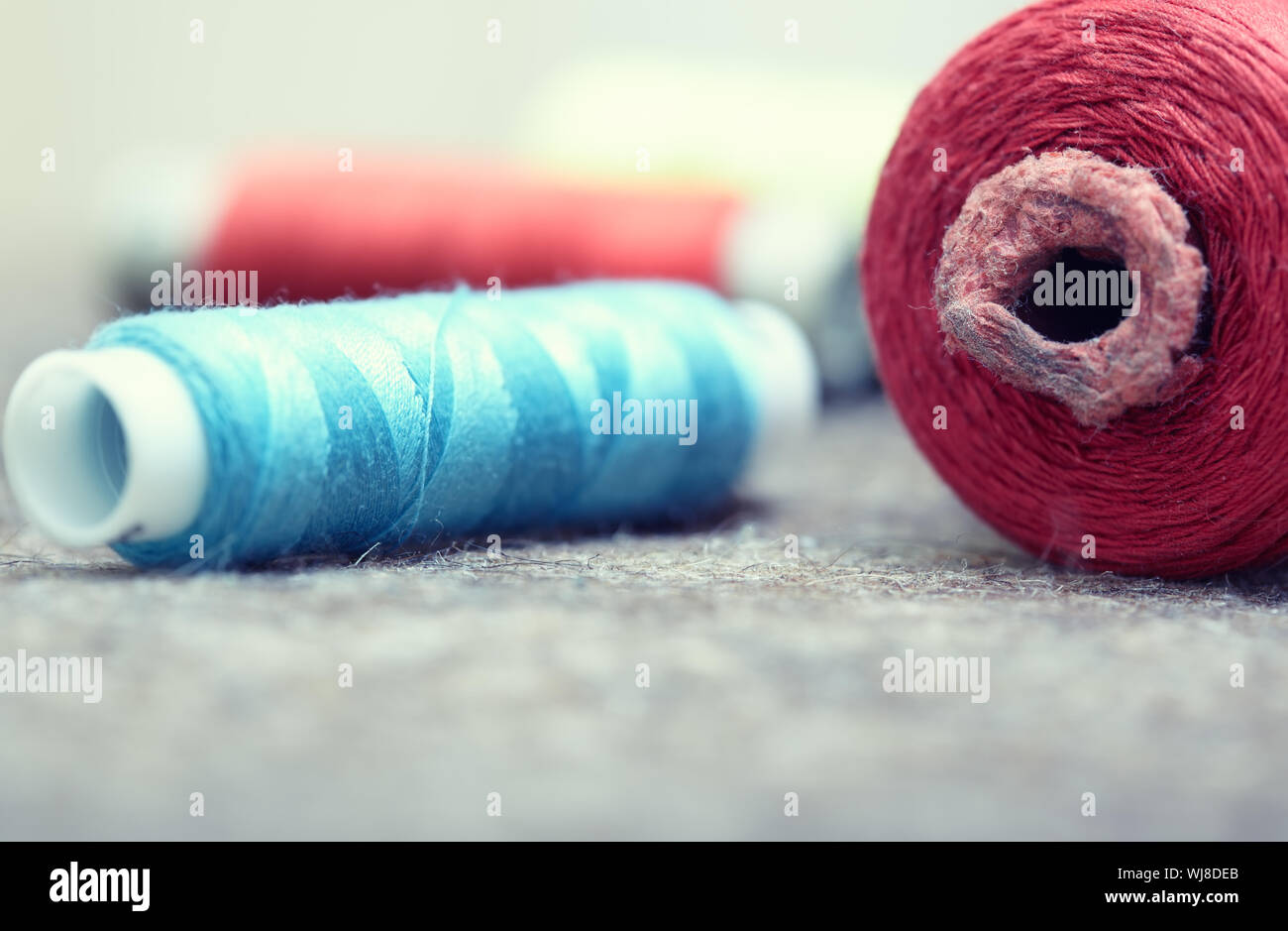 Red and blue sewing pools. Close-up photo Stock Photo - Alamy