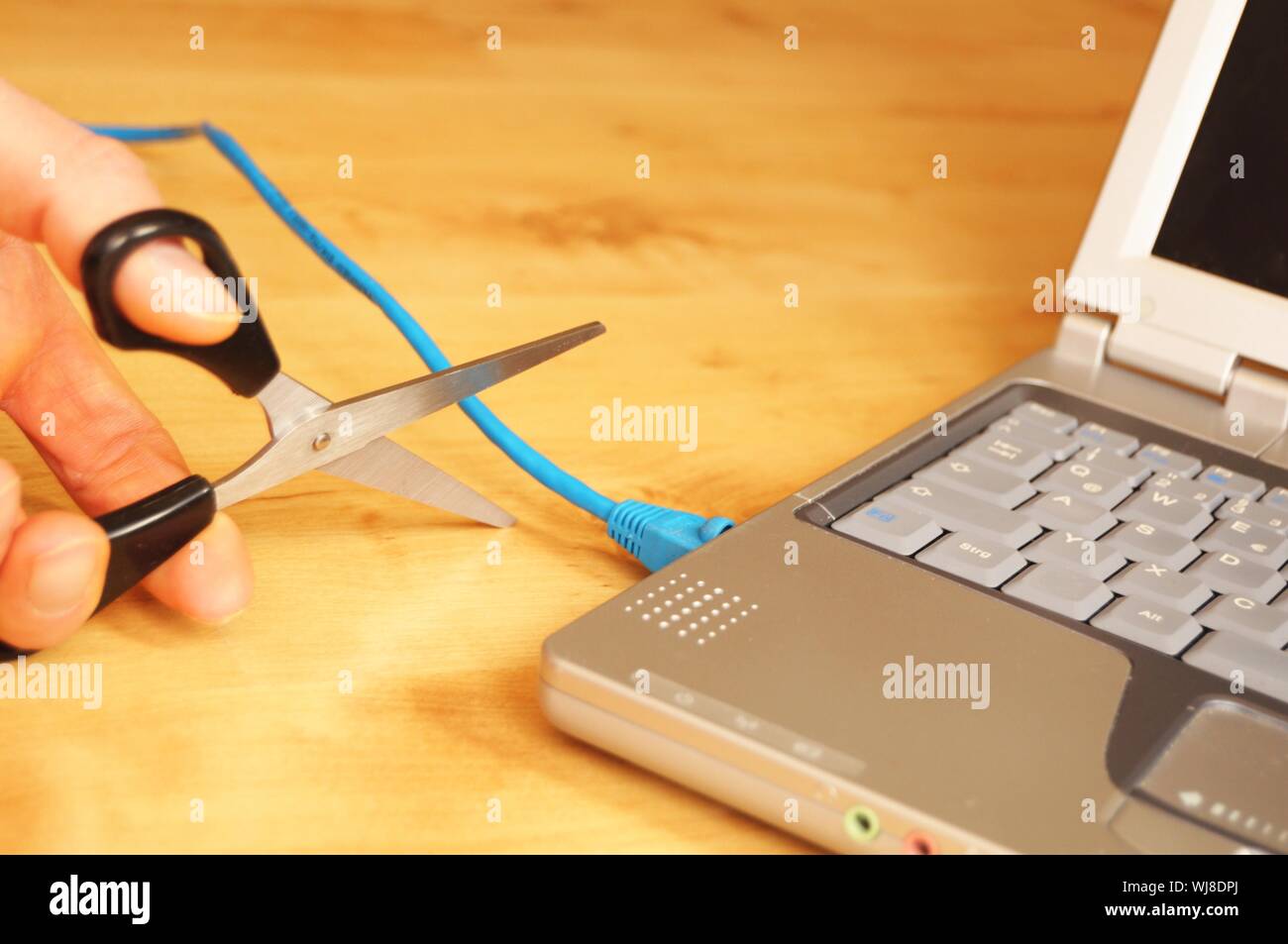 wireless lan or internet connection concept with laptop cable and ...