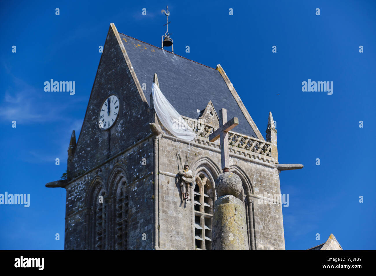 During D-Day invasion, the parachutist was caught on the steeple. The ...