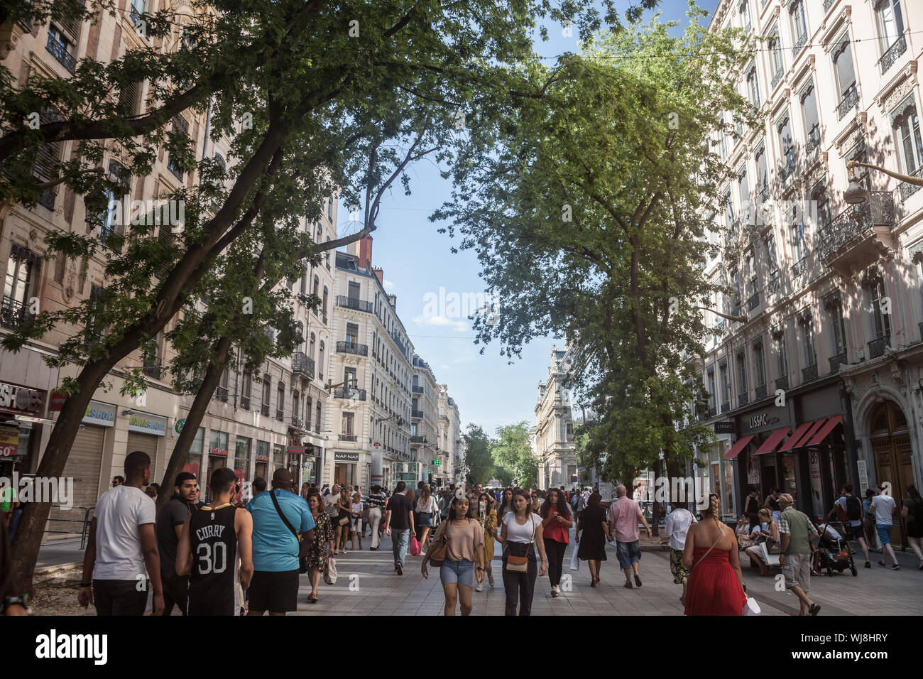 LYON, FRANCE - JULY 13, 2019: Crowd of Pedestrians walking on rue de la ...