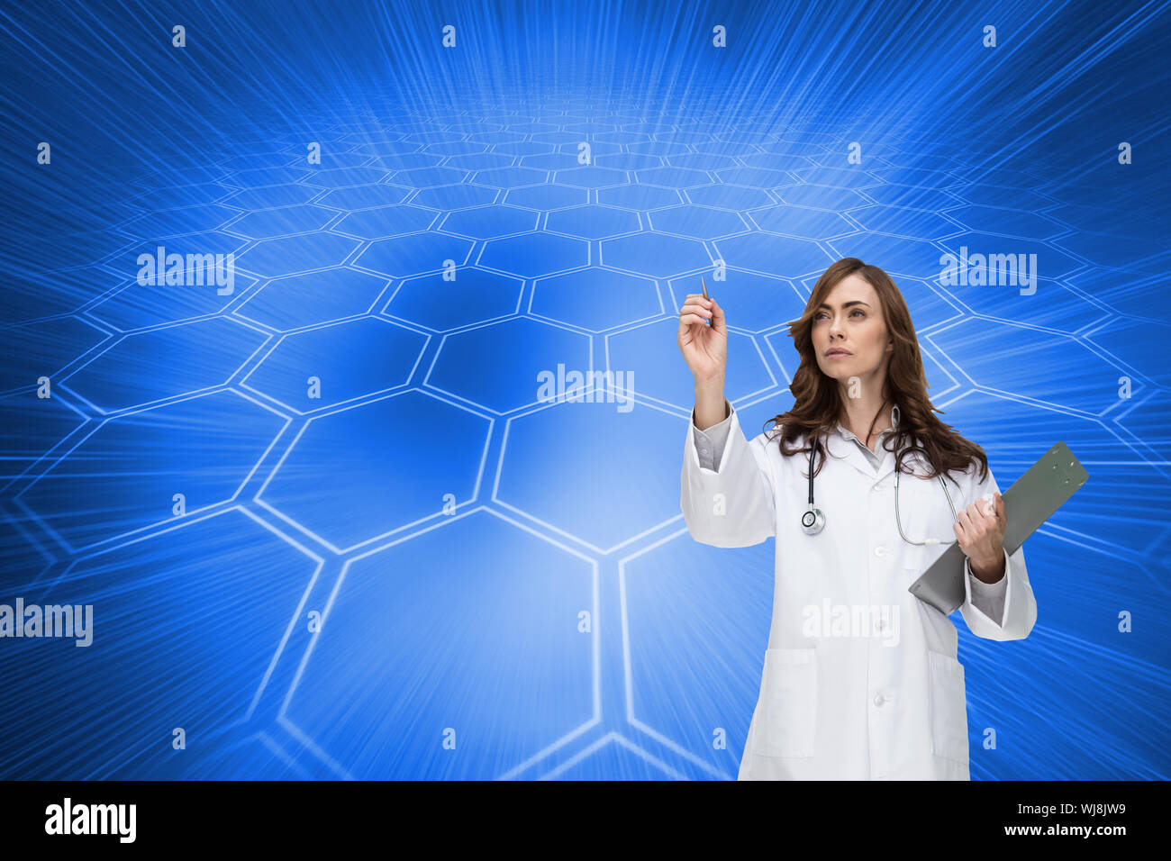 Composite image of stern brunette doctor pointing Stock Photo - Alamy
