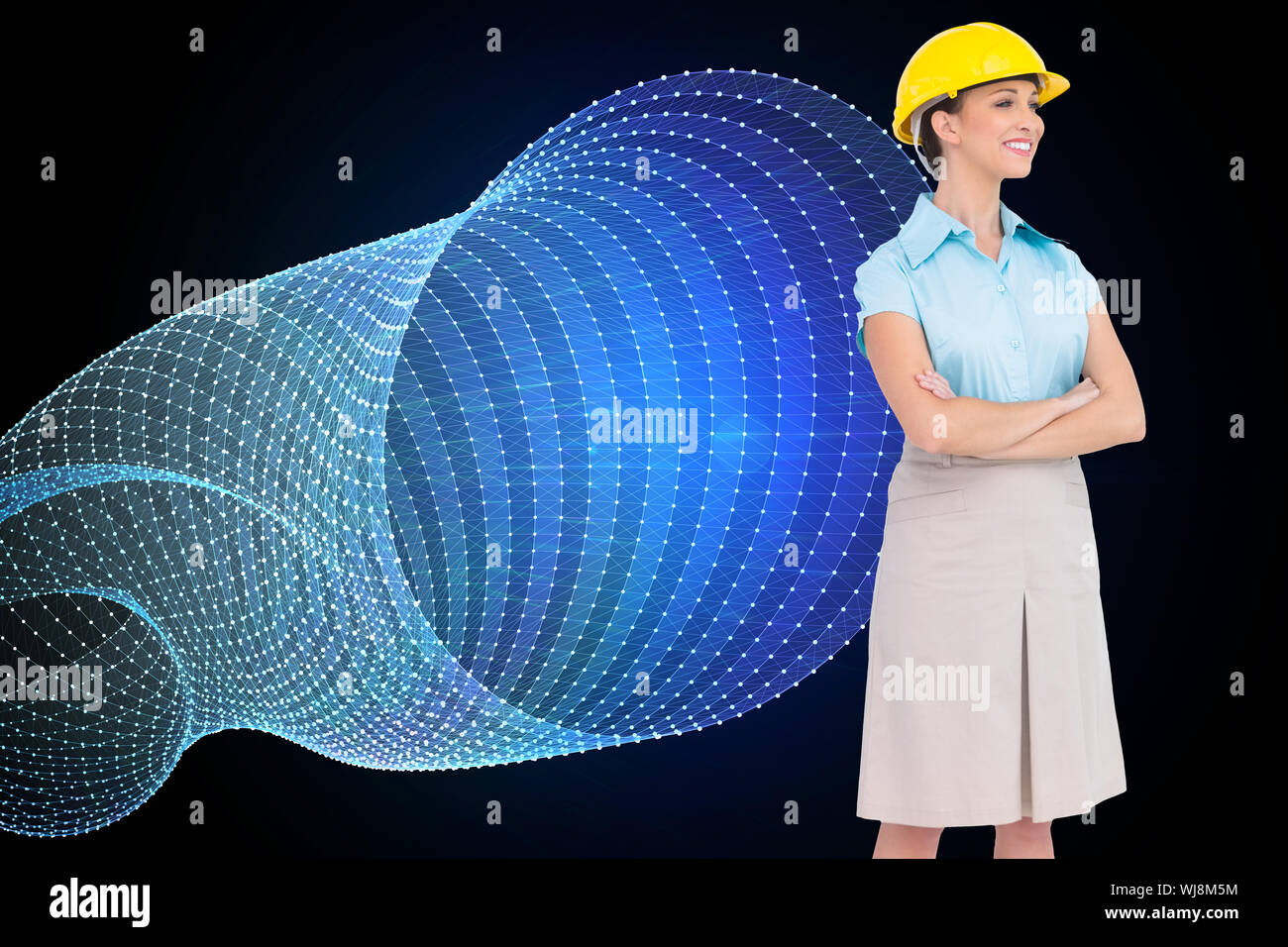 Composite image of smiling attractive architect posing Stock Photo - Alamy