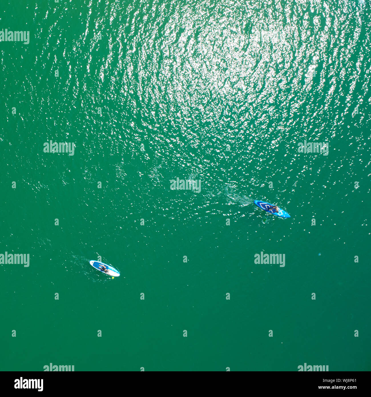 Aerial view of sup boards on the sea. Top view of two paddleboard on a ...