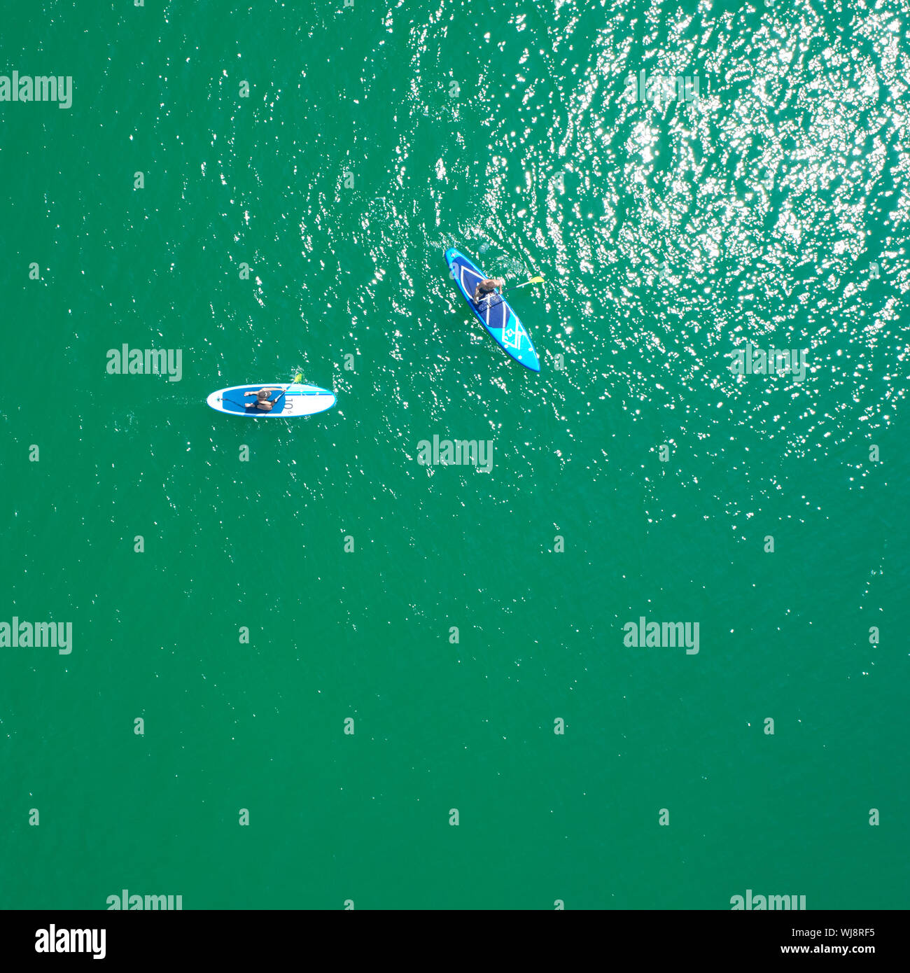 Aerial view of sup boards on the sea. Top view of two paddleboard on a ...