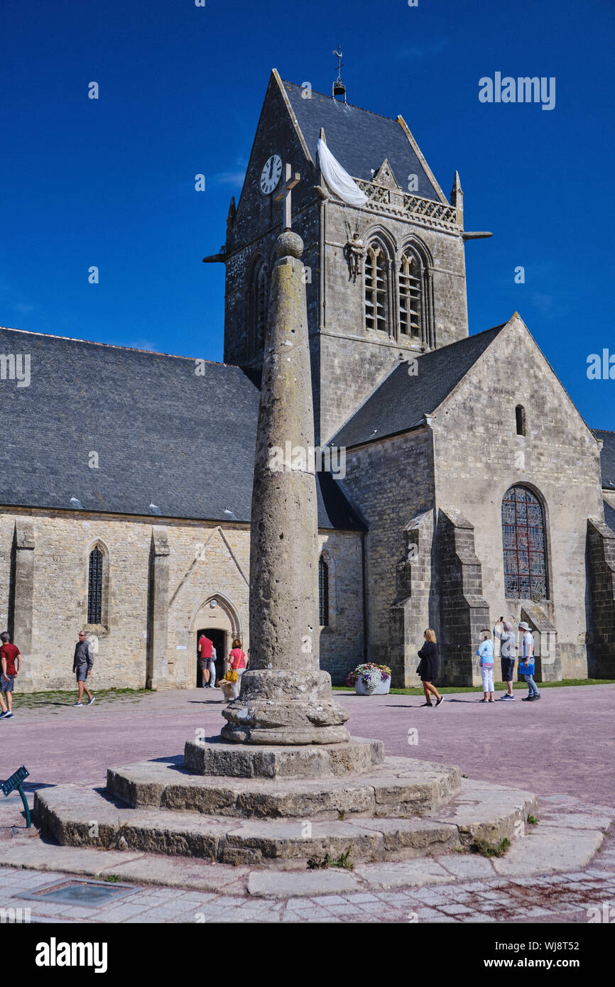 During D-Day invasion, the parachutist was caught on the steeple. The ...