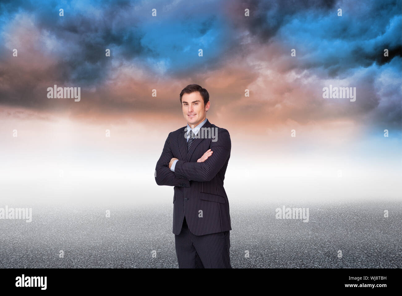 Composite image of young attractive businessman standing cross-armed ...