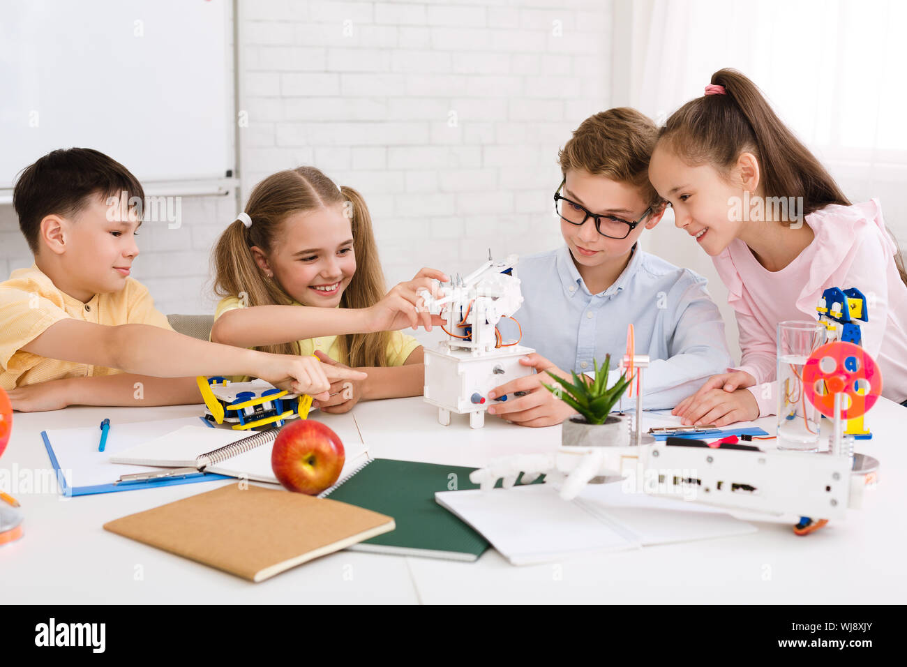 Children constructing robotic device at stem class Stock Photo - Alamy