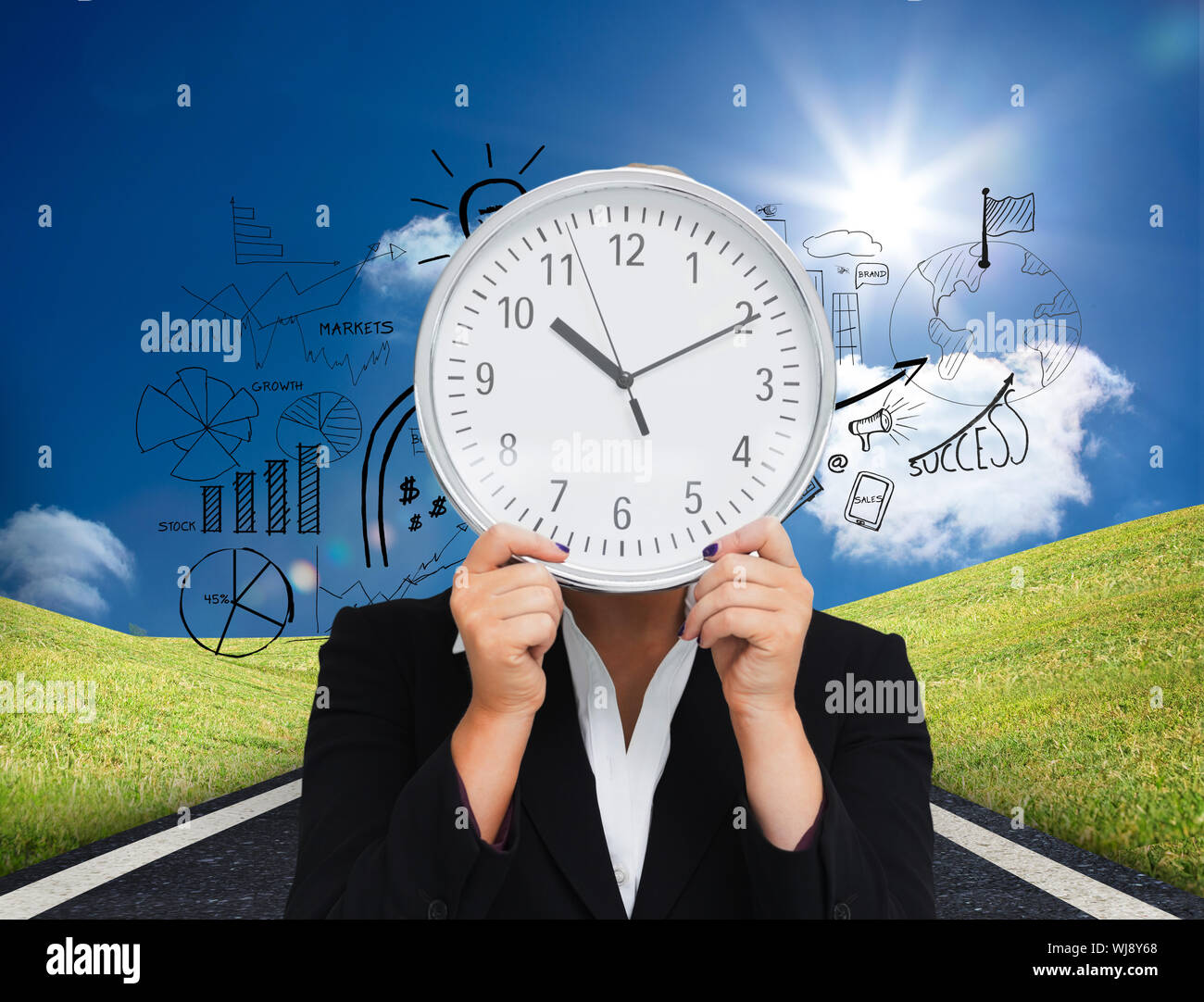 Composite image of businesswoman in suit holding a clock against white ...