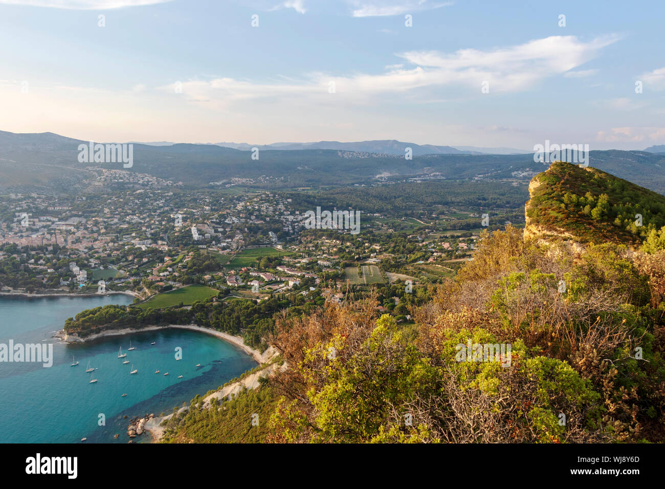 Cap Canaille golden yellow cliffs overlooking Gulf of Cassis and town ...