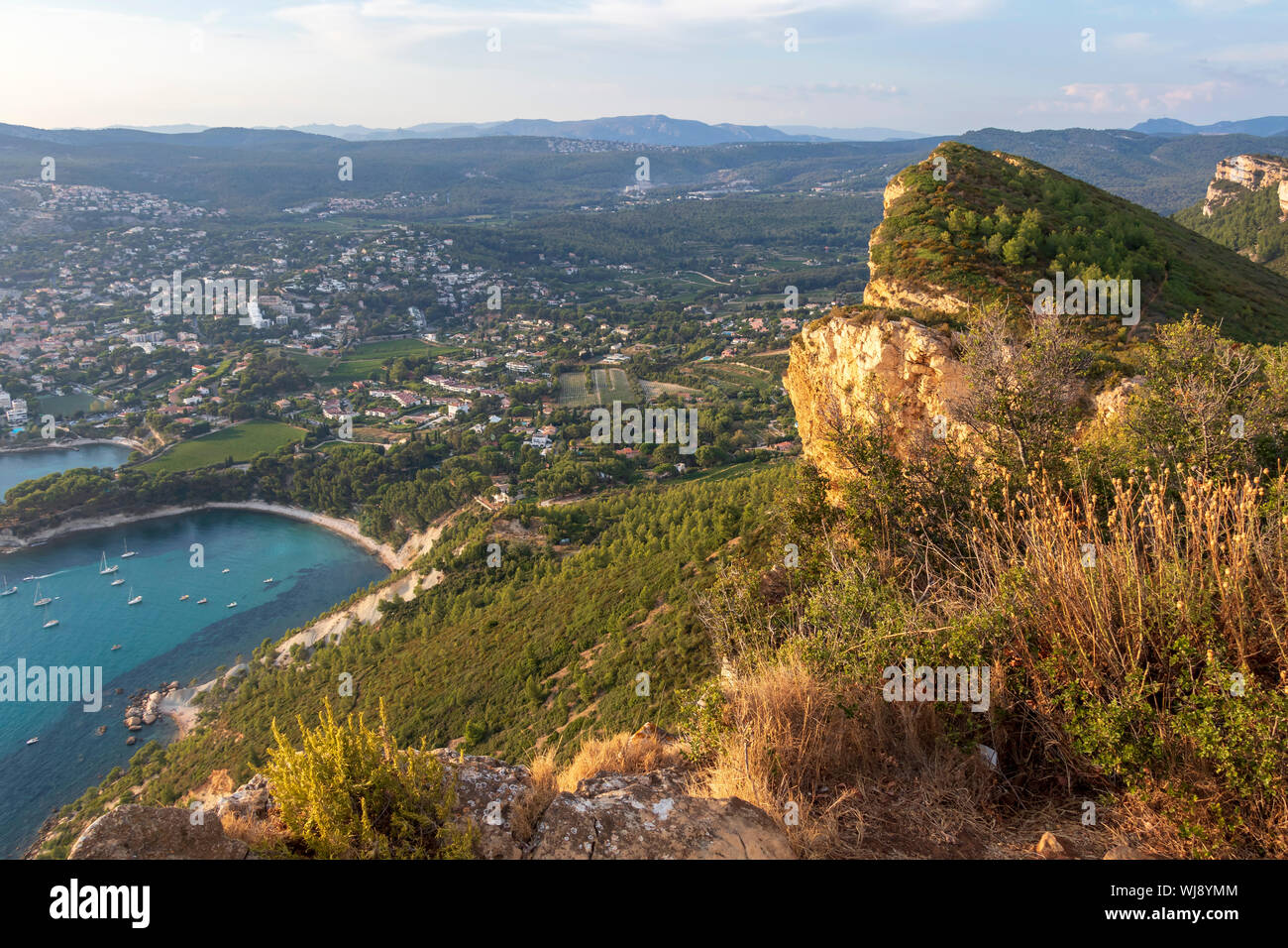 Cap Canaille golden yellow cliffs overlooking Gulf of Cassis and town ...