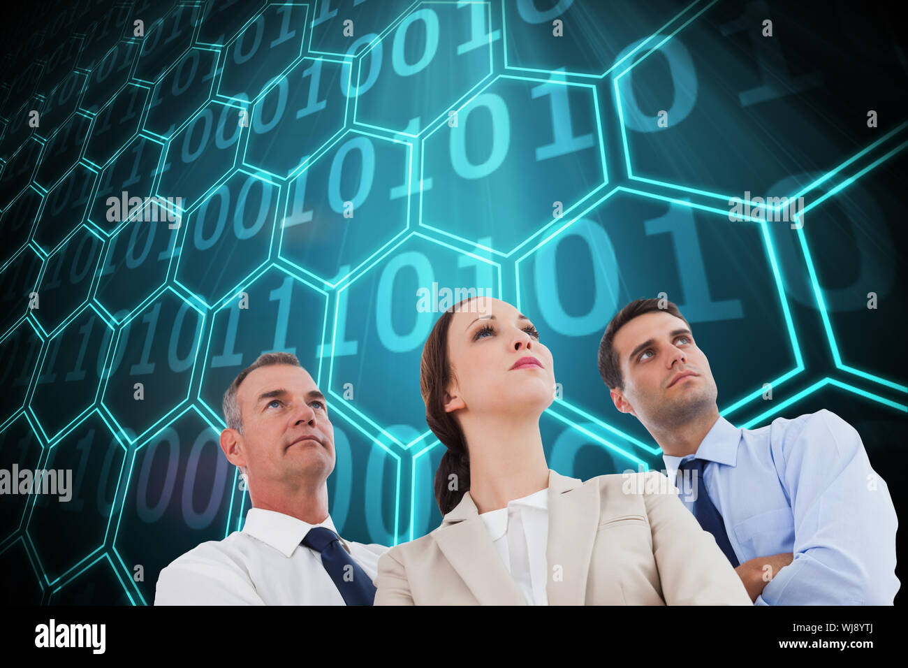 Composite image of serious work team posing together looking away on ...