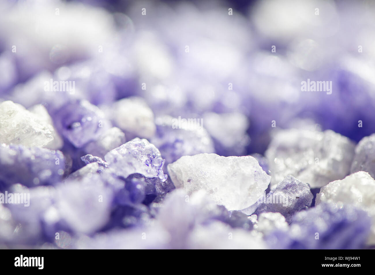 Violet crystals of natural sea salt close-up background Stock Photo - Alamy