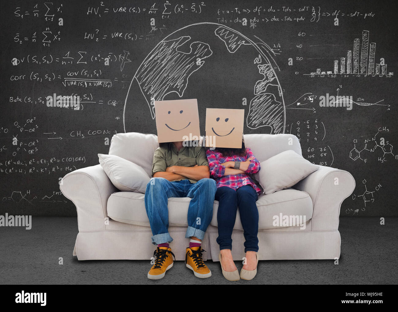 Composite image of silly employees with arms folded wearing boxes on ...