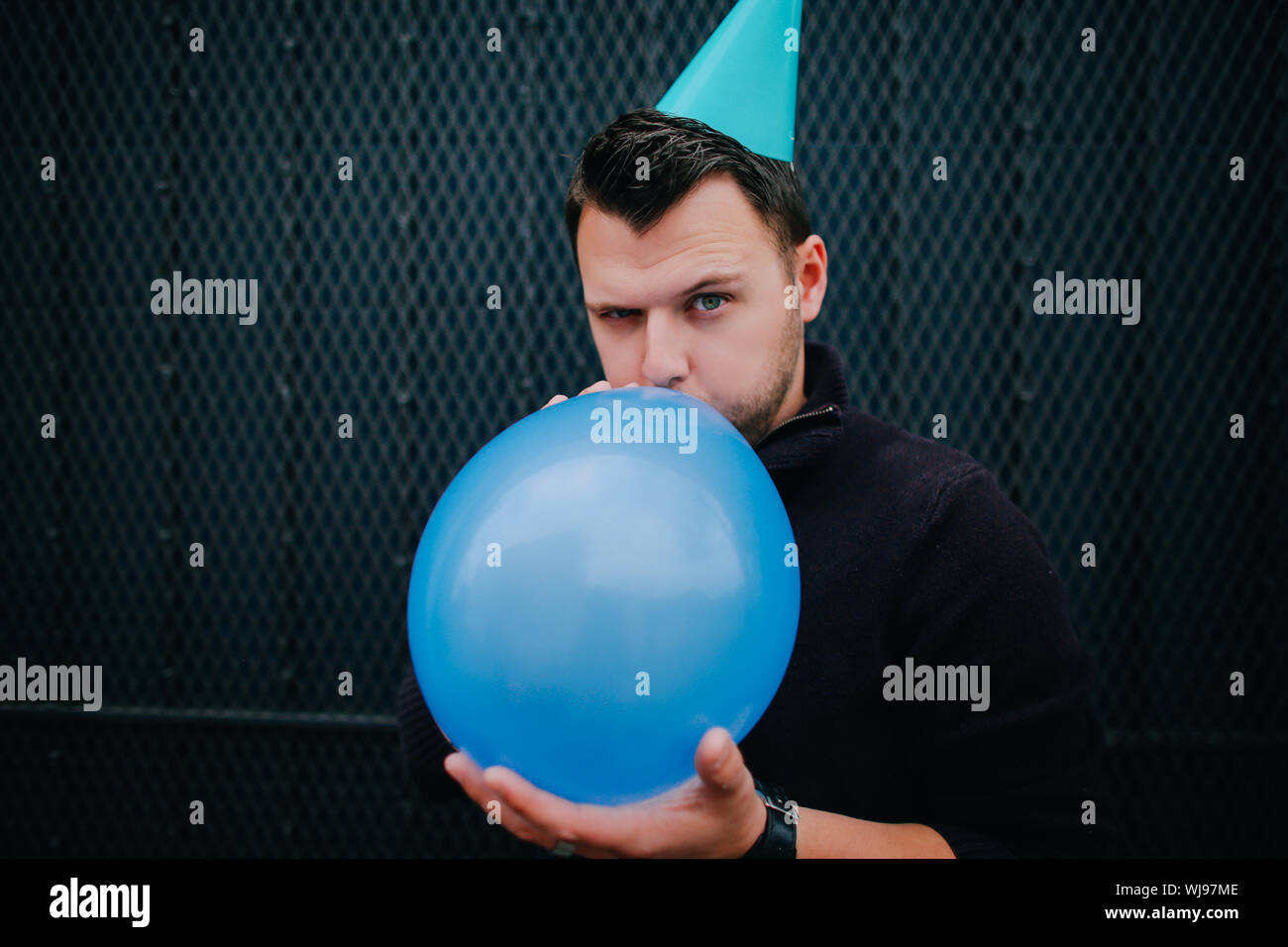 Blowing Balloon Man High Resolution Stock Photography and Images - Alamy