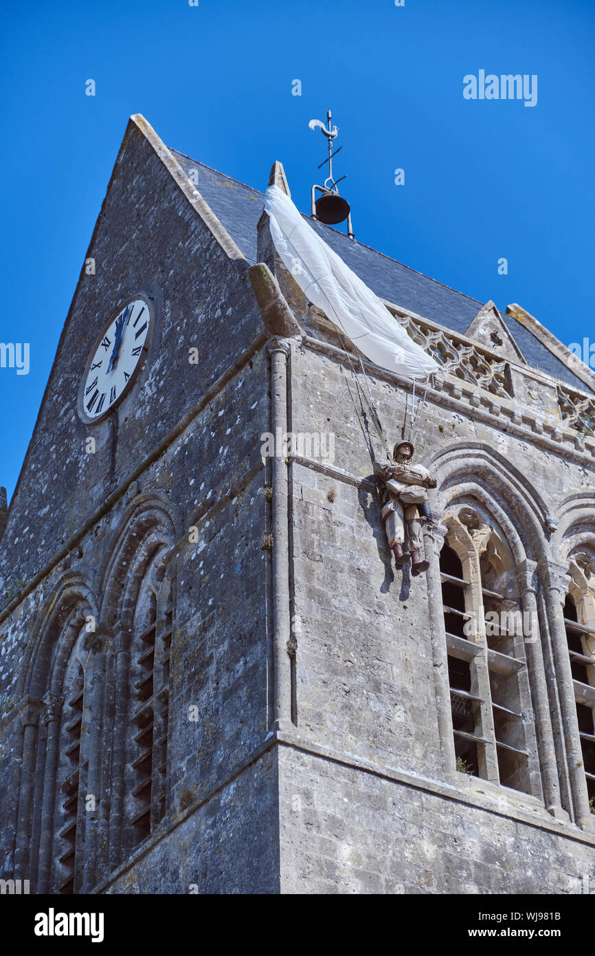 During D-Day invasion, the parachutist was caught on the steeple. The ...