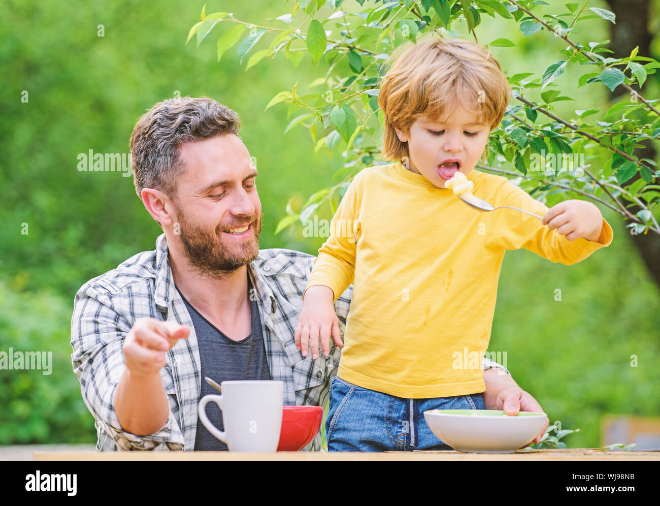 Father son eat food and have fun. Food habits. Little boy with dad ...
