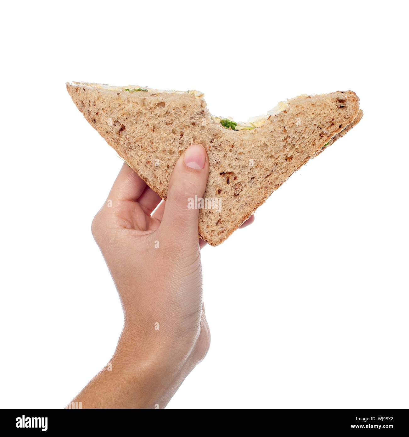 Female hand holding bitten sandwich isolated on white Stock Photo - Alamy