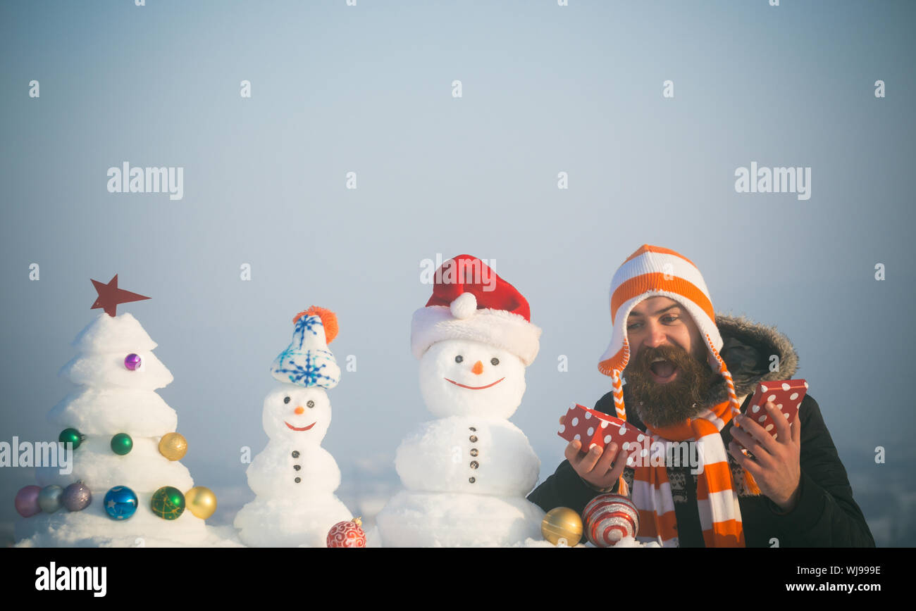 Surprised hipster with present box on winter day Stock Photo - Alamy