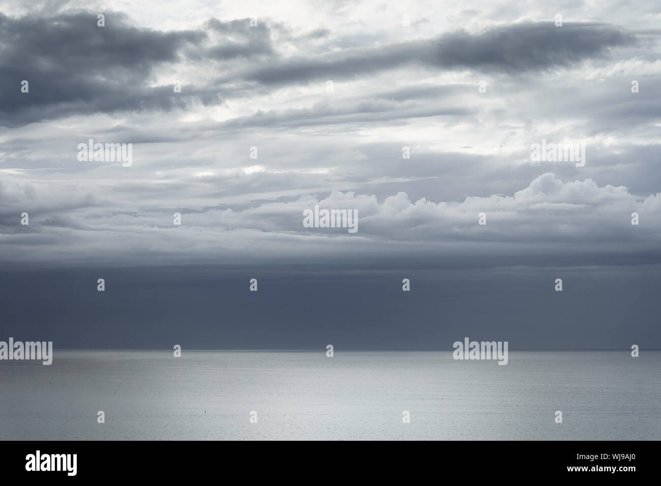 Grey clouds over the sea hi-res stock photography and images - Alamy