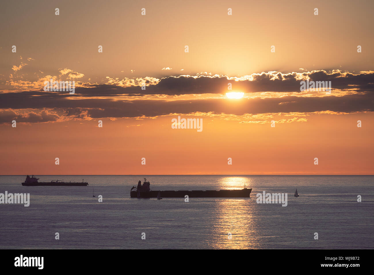 Beautiful sunset on sea ships hi-res stock photography and images - Alamy