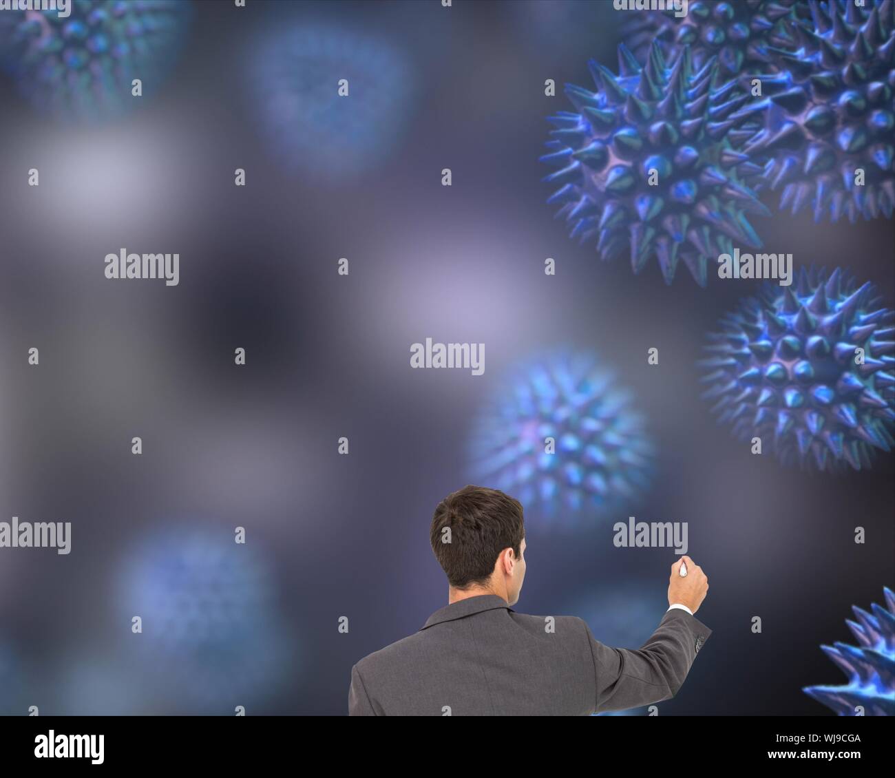 Composite image of businessman standing back to camera writing with ...