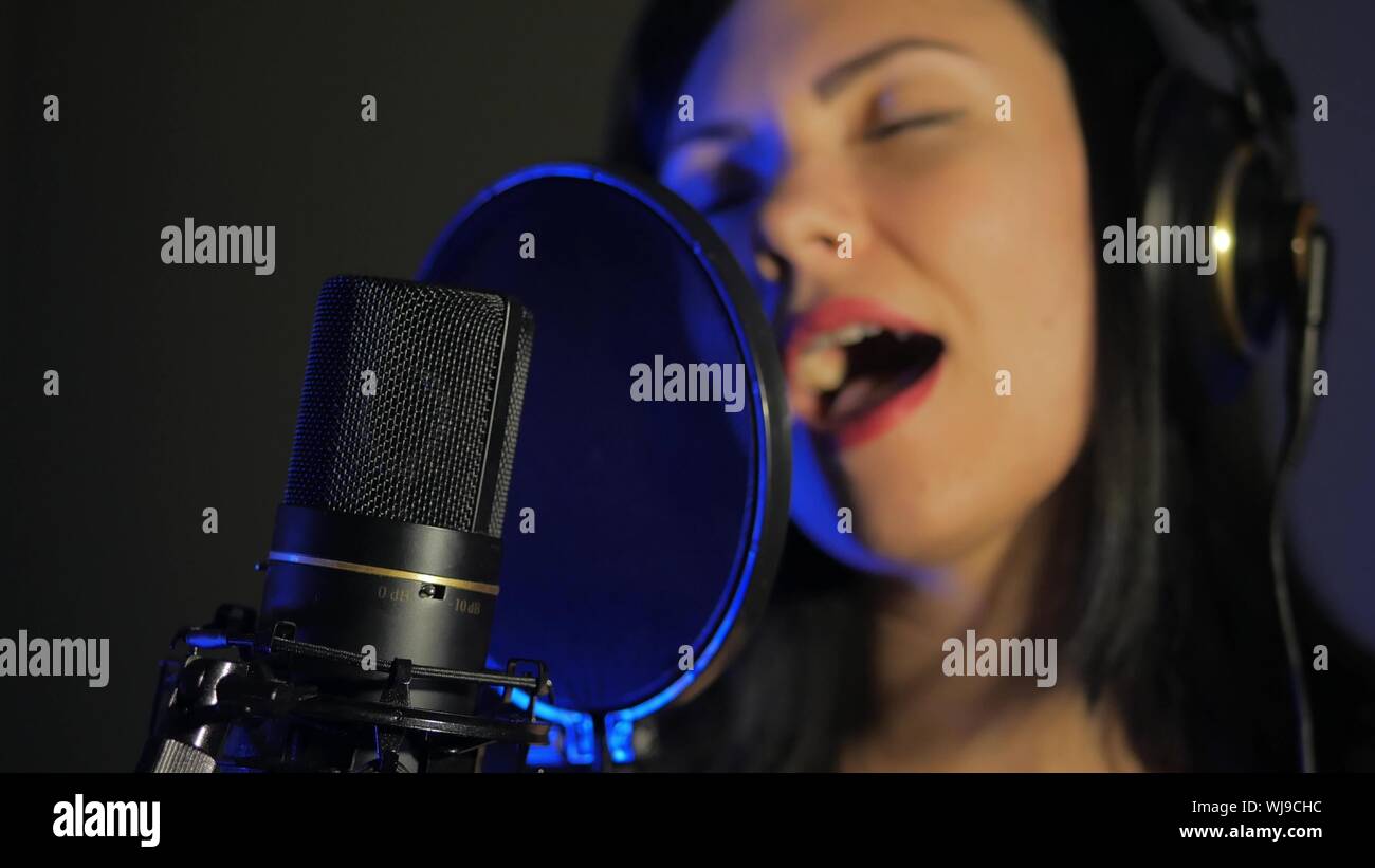 Woman singing music recording studio hi-res stock photography and ...