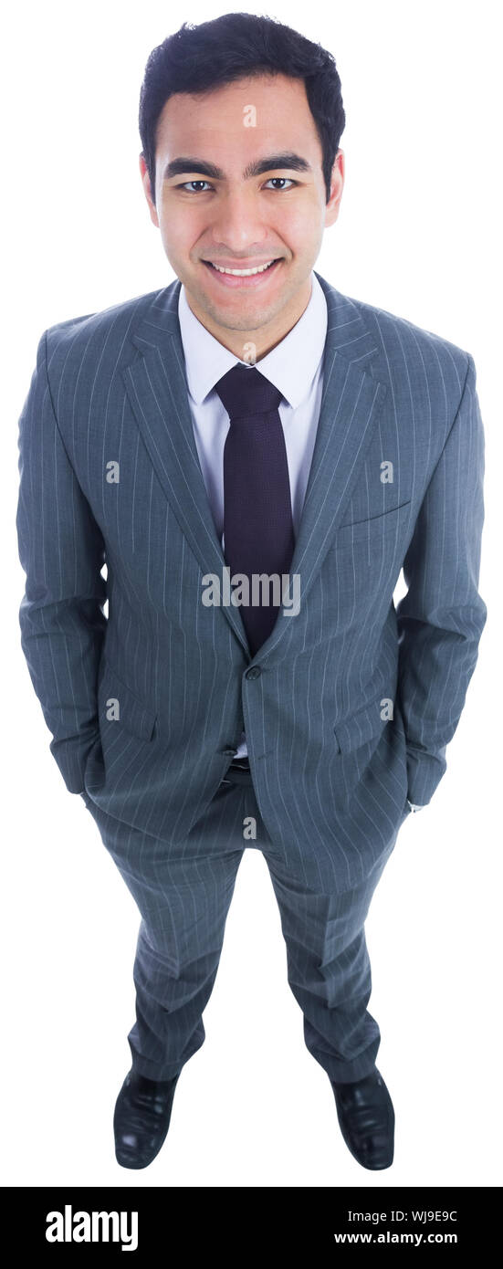 Smiling businessman standing Stock Photo - Alamy