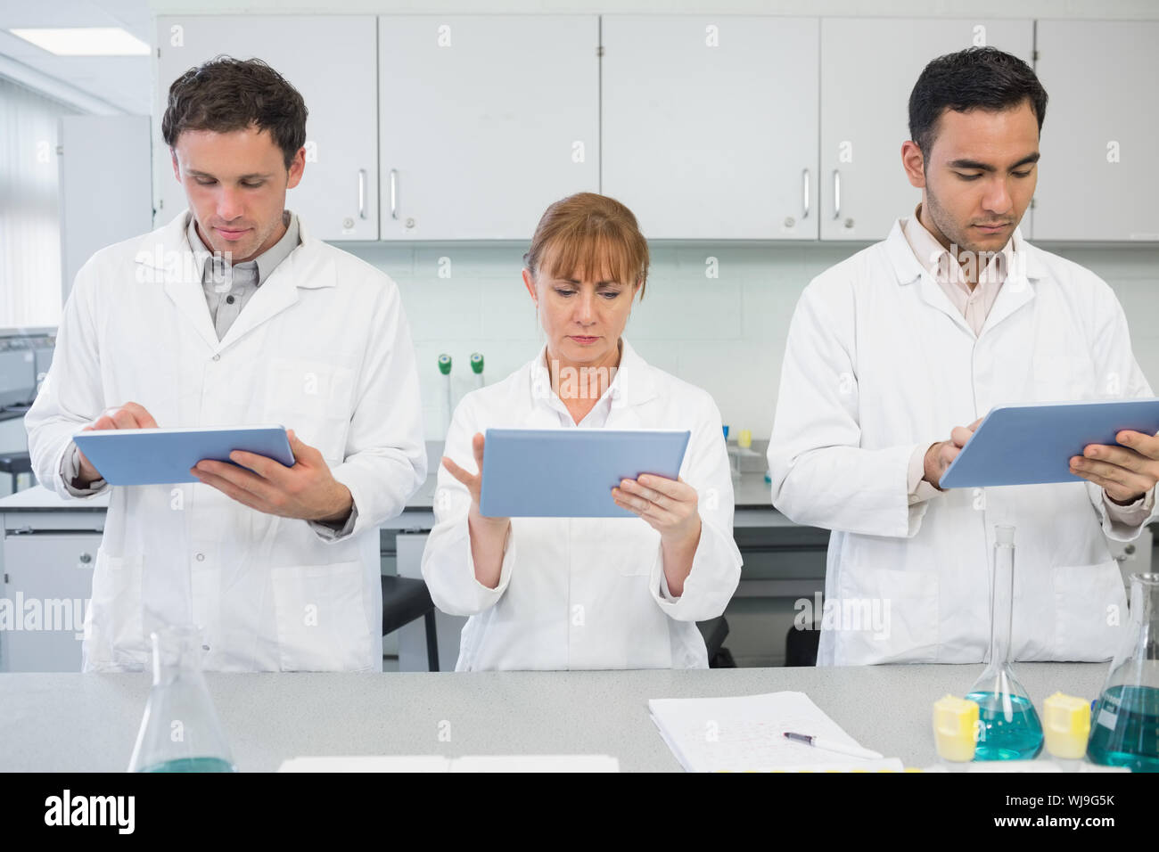Group serious scientists using hi-res stock photography and images - Alamy