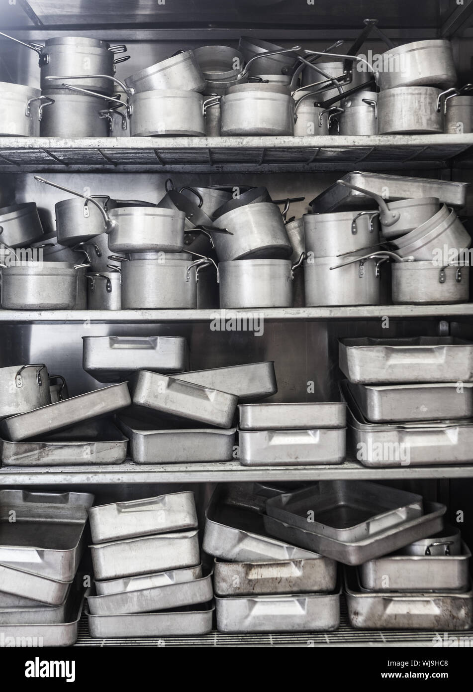 Shelf full of pots all in chrome Stock Photo - Alamy