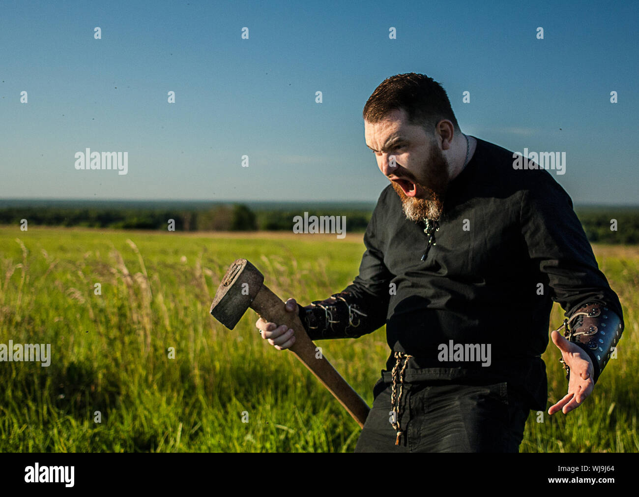 Angry holding axe hi-res stock photography and images - Alamy