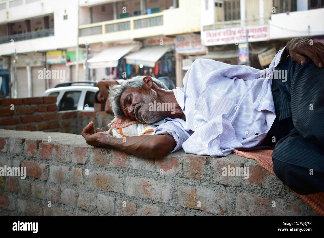 Homeless indian man sleeping on hi-res stock photography and images - Alamy