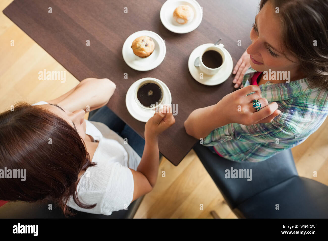 Two students having a cup of coffee in college canteen Stock Photo - Alamy