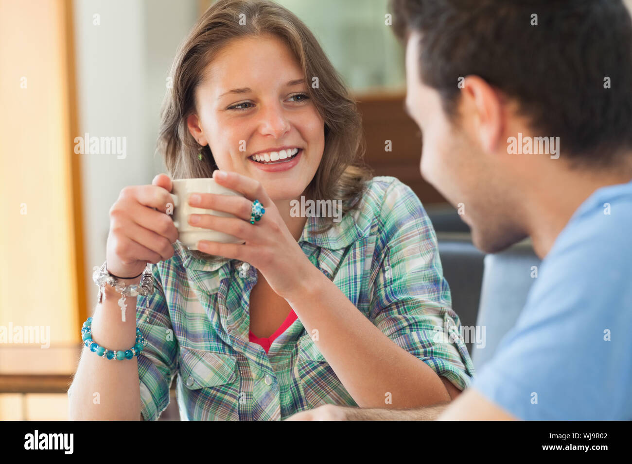 Two casual students having a cup of coffee in college canteen Stock ...