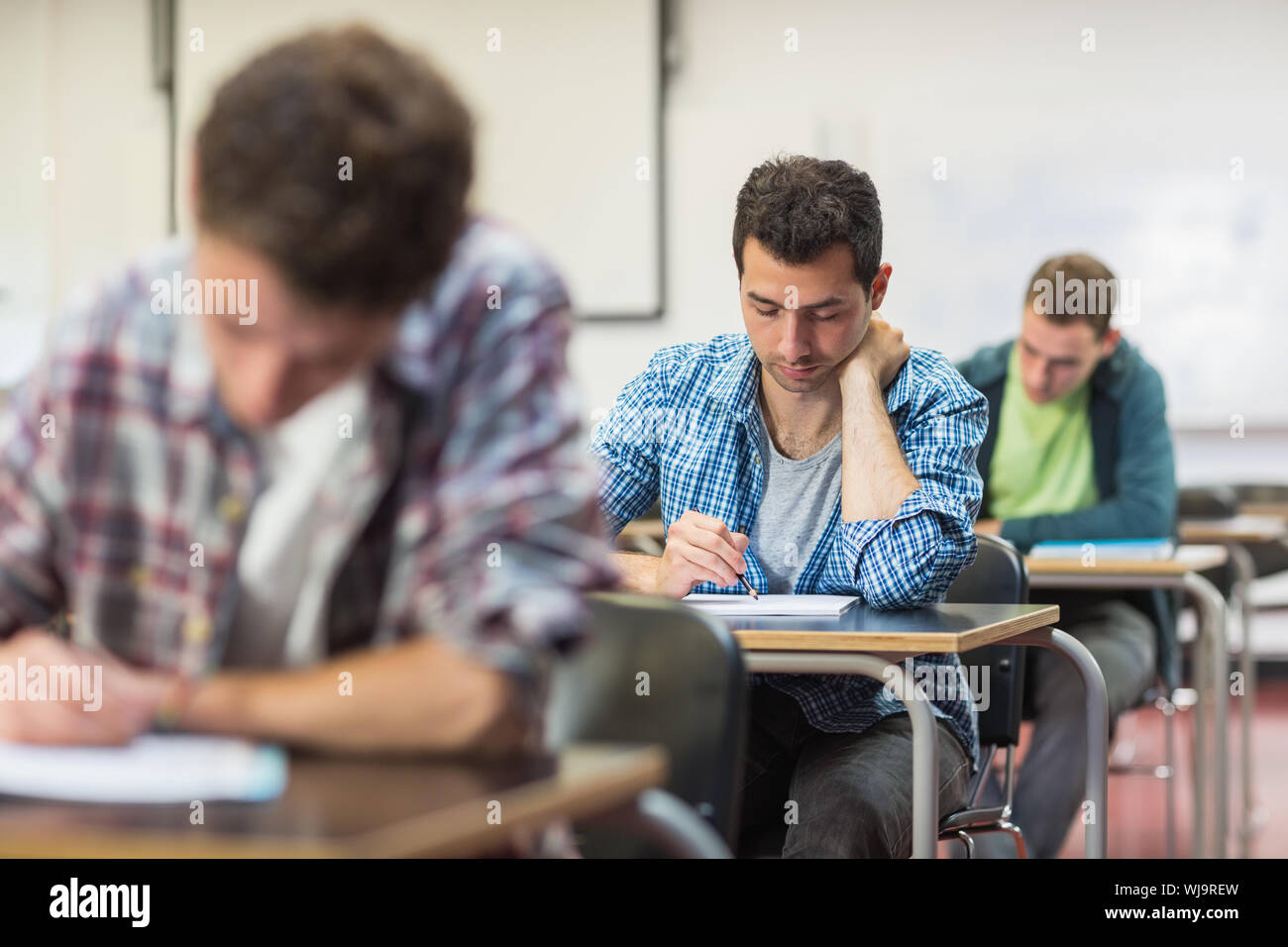 Students writing notes hi-res stock photography and images - Alamy