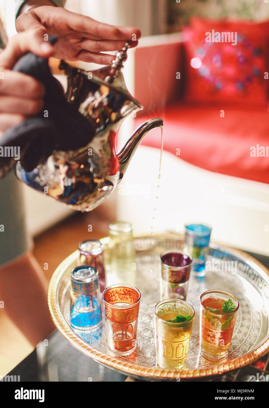 Woman pouring tea pot hi-res stock photography and images - Alamy