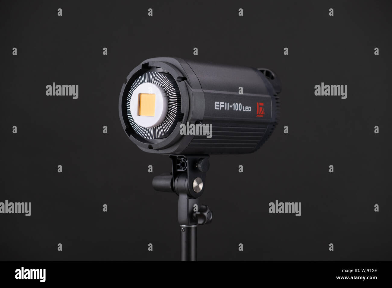 Studio professional flash is a pulsed light source on black background ...