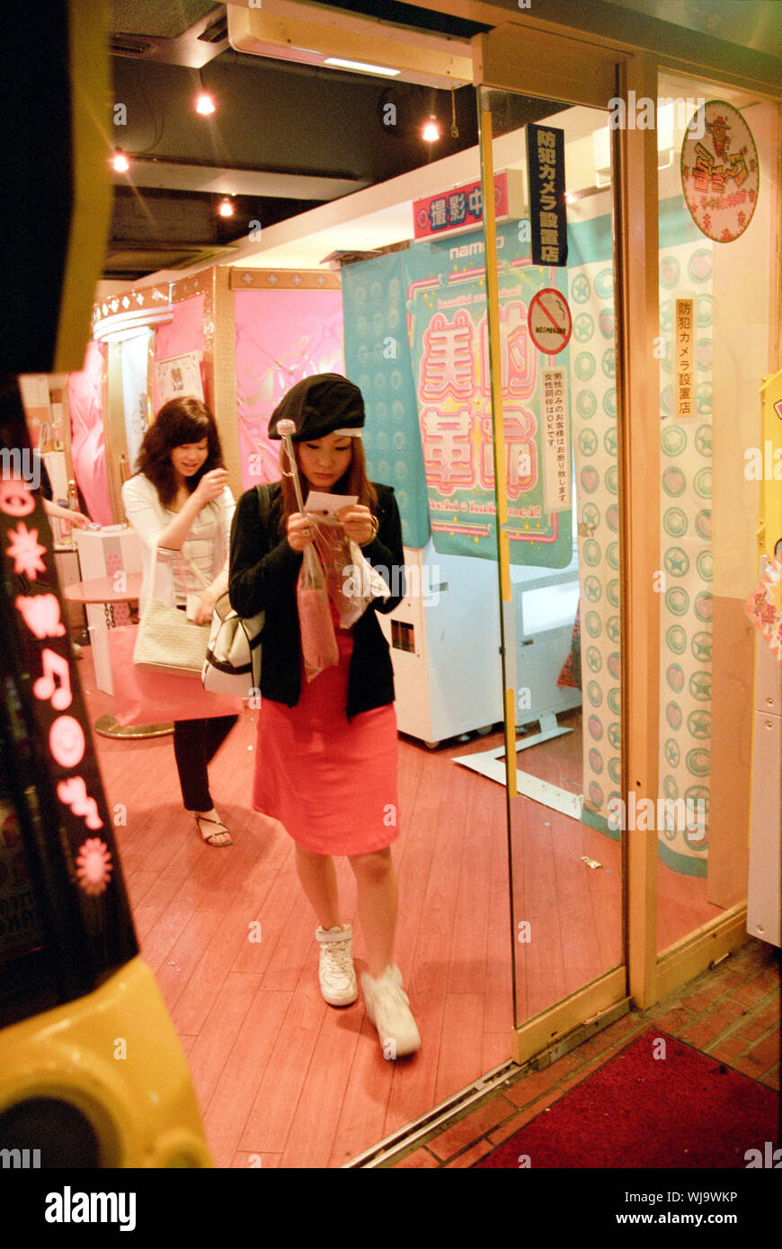 a young woman leave a Shibuya photo booth. Shibuya district, Tokyo ...