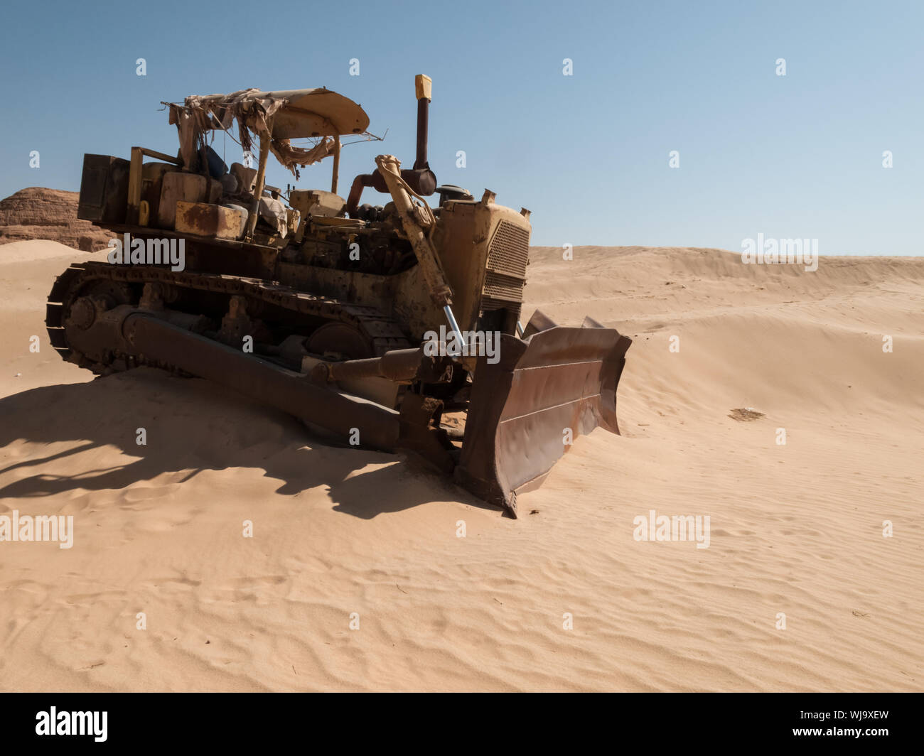 An old bulldozer abandoned in the middle of the desert in Saudi Arabia ...