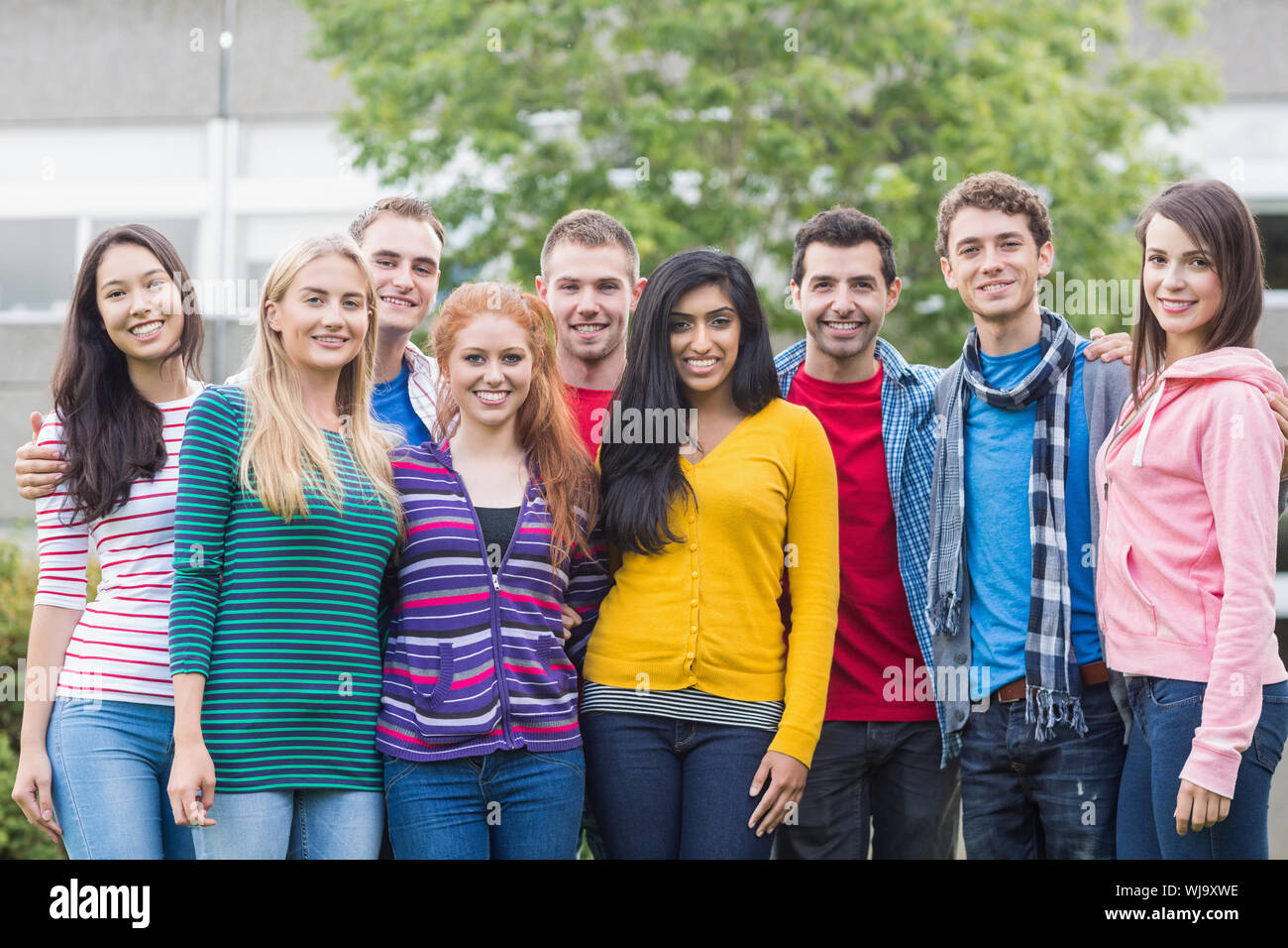 Group portrait of young college students standing in the park Stock ...