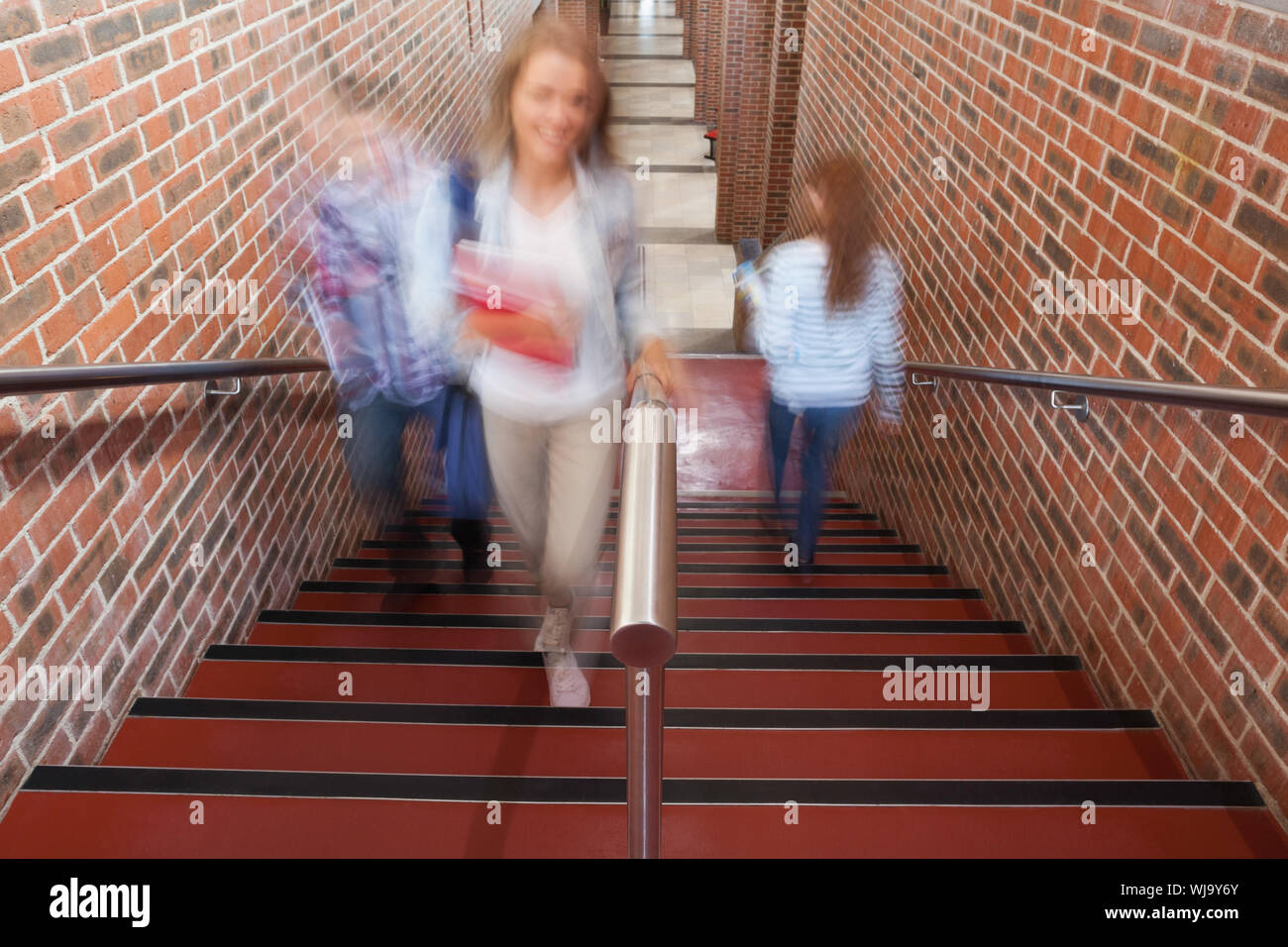 Climbing stairs with books hi-res stock photography and images - Alamy