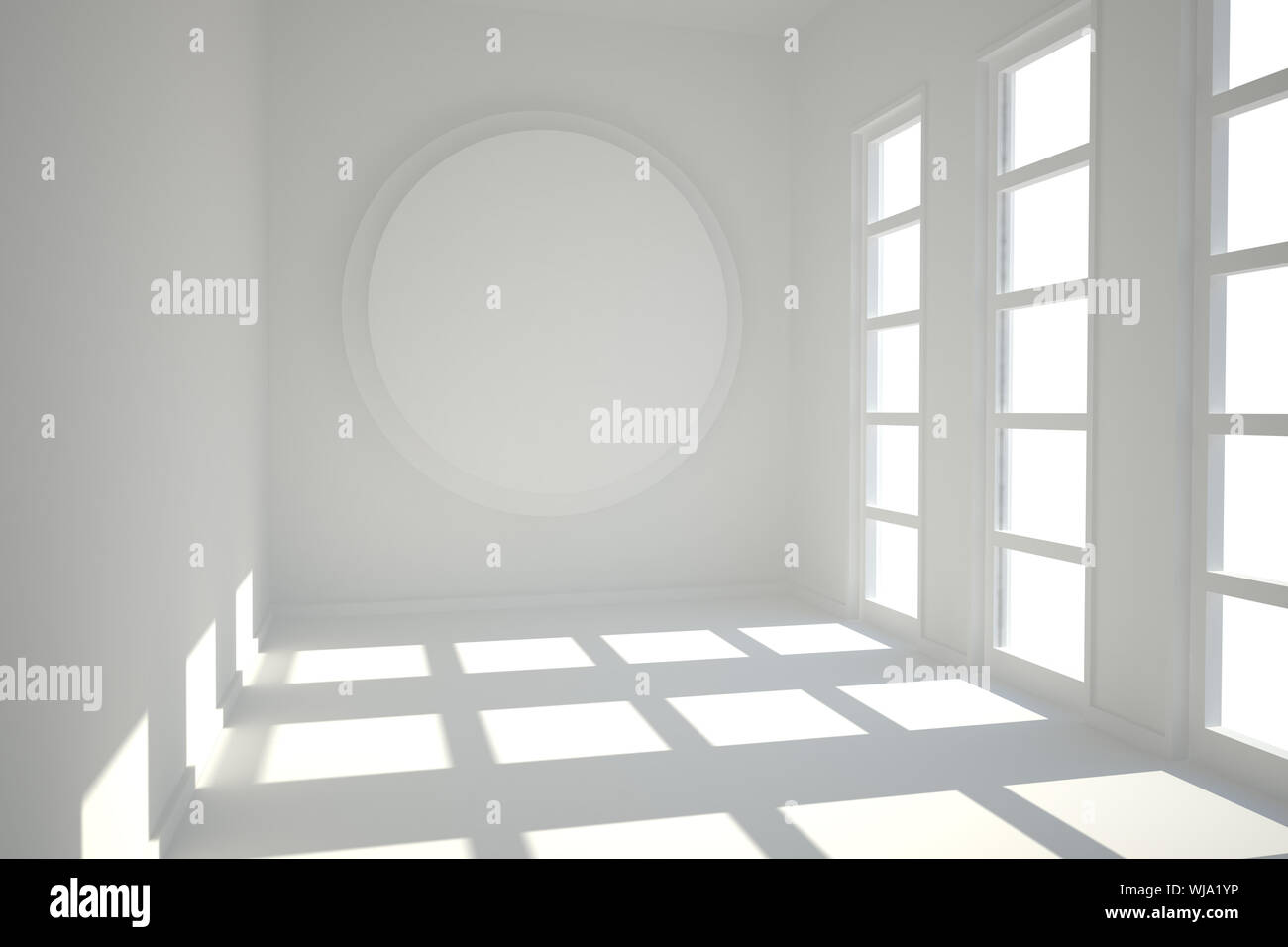 White room with circle at wall and bright windows Stock Photo - Alamy