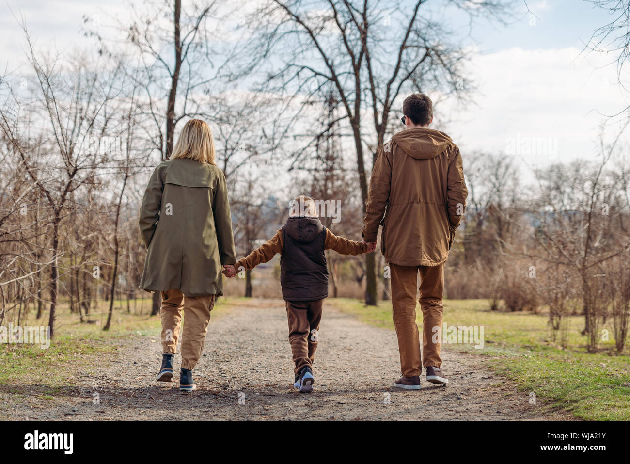 Family Walking Together From Behind