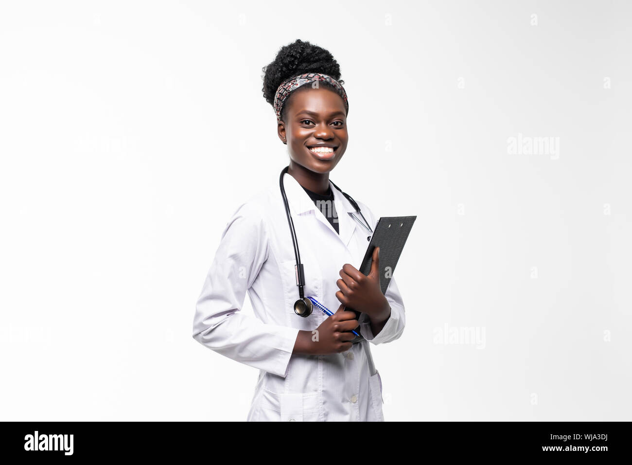 happy african medical intern doctor writing on clipboard Stock Photo ...