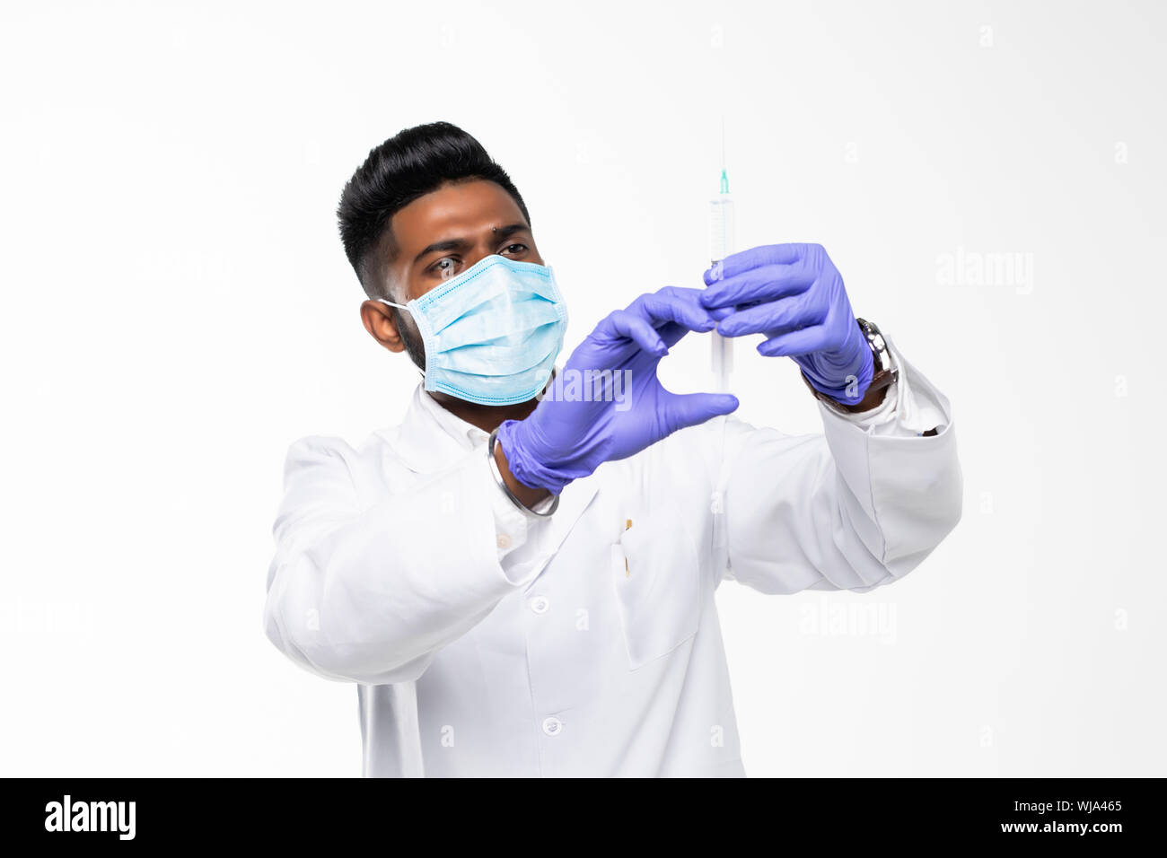 treatment concept. man curing sick people. look at the syringe. close ...