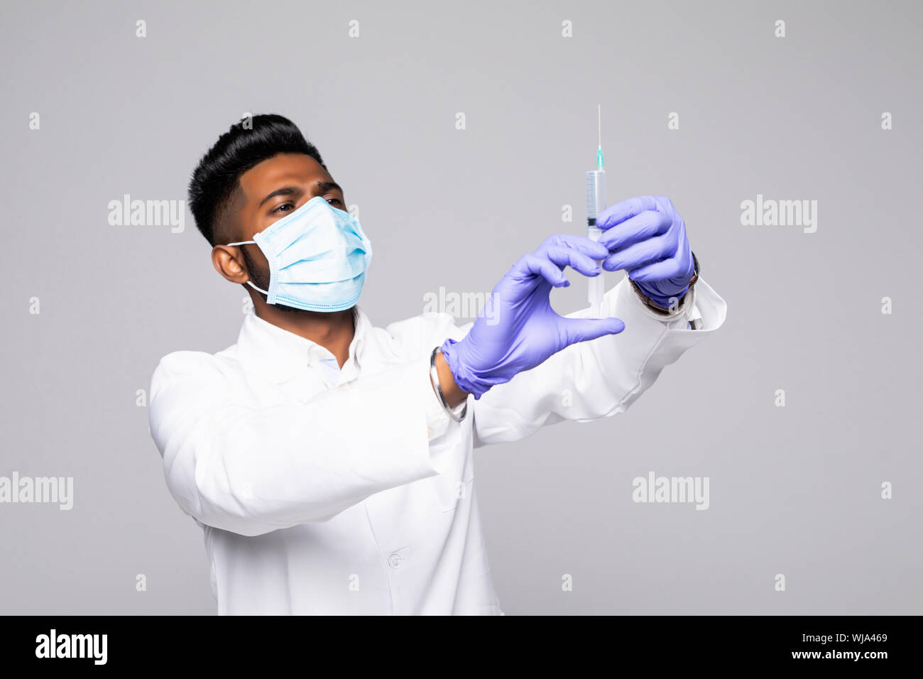 treatment concept. man curing sick people. look at the syringe. close ...