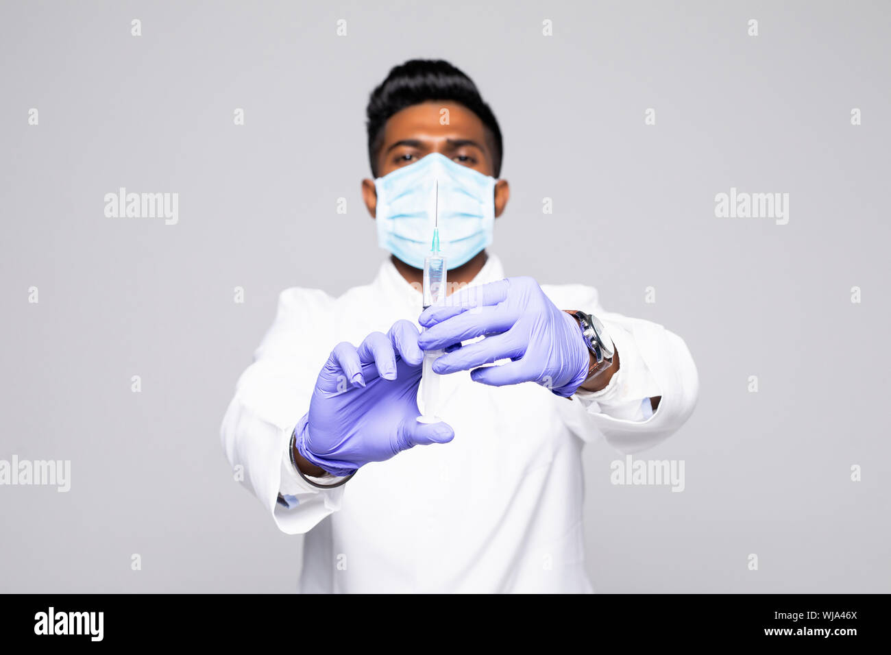 treatment concept. man curing sick people. look at the syringe. close ...