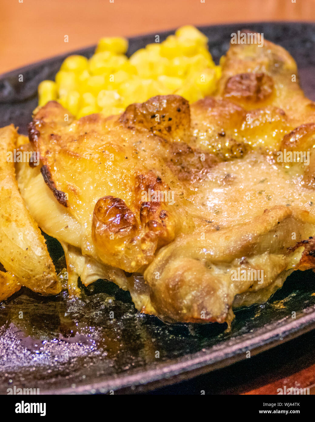 Chicken, French fries, and corn in metal plate Stock Photo - Alamy